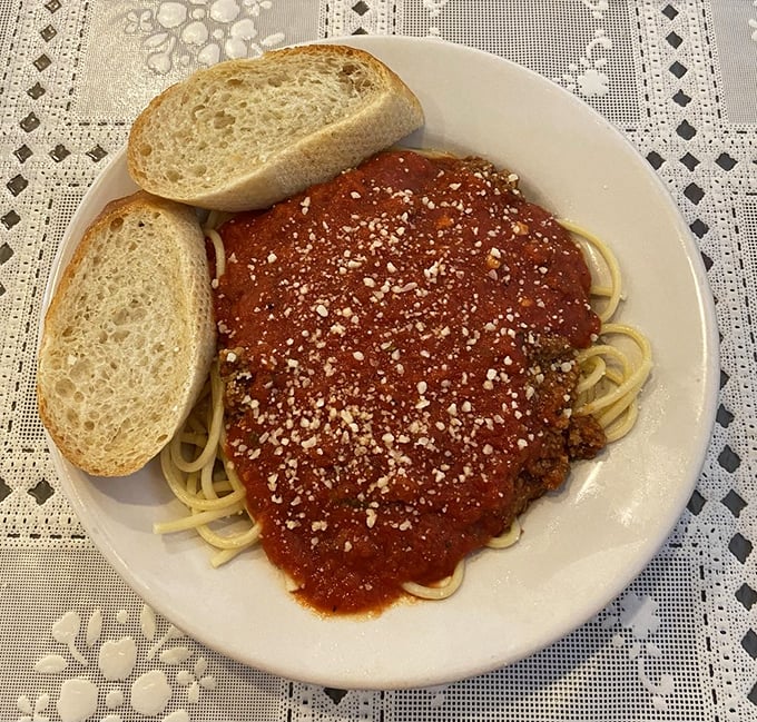 Simple pleasures done right&mdash;spaghetti with meat sauce and fresh bread. In a world of culinary complications, this plate reminds us why classics never die.