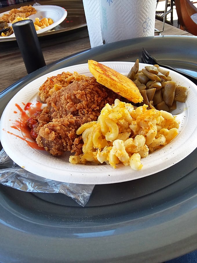 The holy trinity of Southern cuisine: golden-crusted chicken, mac and cheese that's actually cheesy, and cornbread that doesn't know the meaning of "dry."