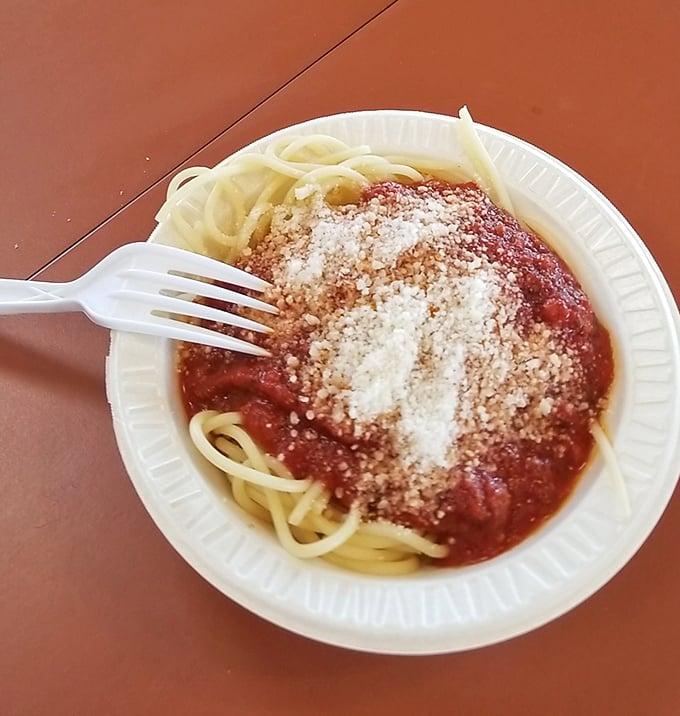 Sometimes perfection comes on a paper plate. This spaghetti with its shower of parmesan is the comfort food equivalent of a warm hug.