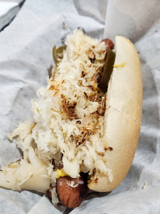 This isn't just a hot dog&mdash;it's a masterpiece of sauerkraut architecture that would make Frank Lloyd Wright jealous.