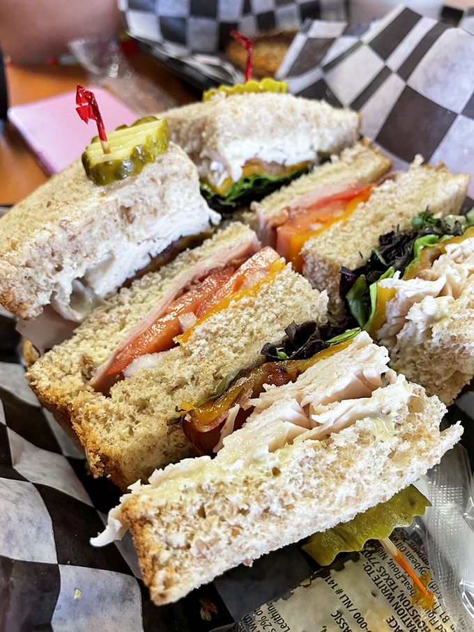 Layer upon layer of thinly-sliced perfection with the careful architecture of a Frank Lloyd Wright design. The club sandwich as high art.