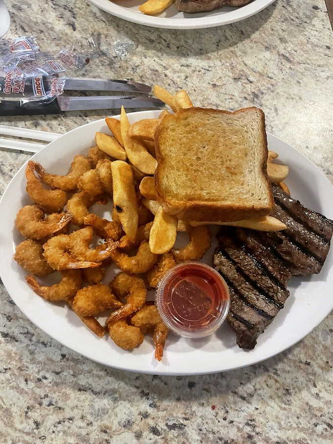 Surf meets turf in this plate of pure joy. Those golden-fried shrimp and sizzling steak strips are the dynamic duo your taste buds deserve.
