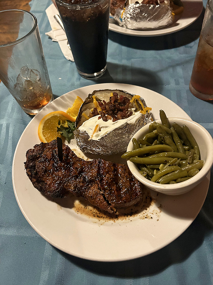 The loaded baked potato alongside that steak isn't playing second fiddle – it's in a duet that deserves a standing ovation and maybe an encore.