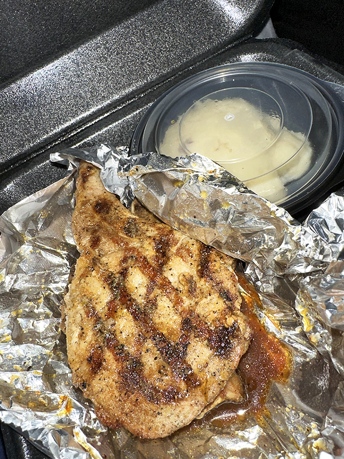 Even to-go orders get the royal treatment—this aluminum-wrapped chicken proves good food travels well, with soup riding shotgun for the journey home.