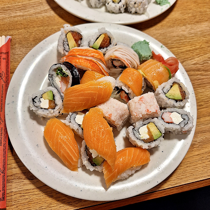 Sushi that's arranged with more care than most people put into their living room furniture. The salmon pieces practically glow with an orange promise.
