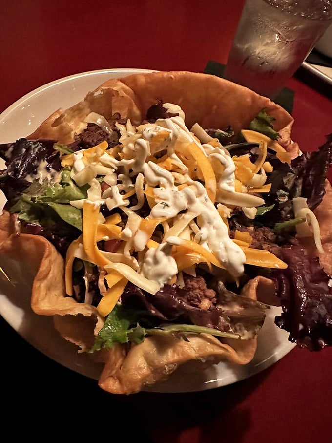 This taco salad doesn't know it's supposed to be just a side dish. The crispy shell cradles fresh greens and cheese like they're precious cargo.