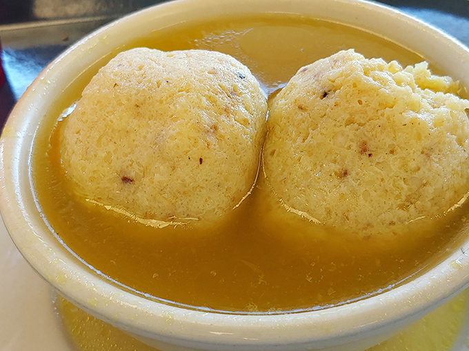 Twin planets of comfort orbiting in a broth universe. These matzo balls aren't just food&mdash;they're edible therapy.