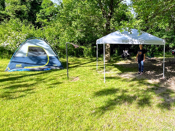 Camping simplified: a blue tent, white canopy, and endless green space&mdash;the three-color palette of perfect outdoor getaways. 