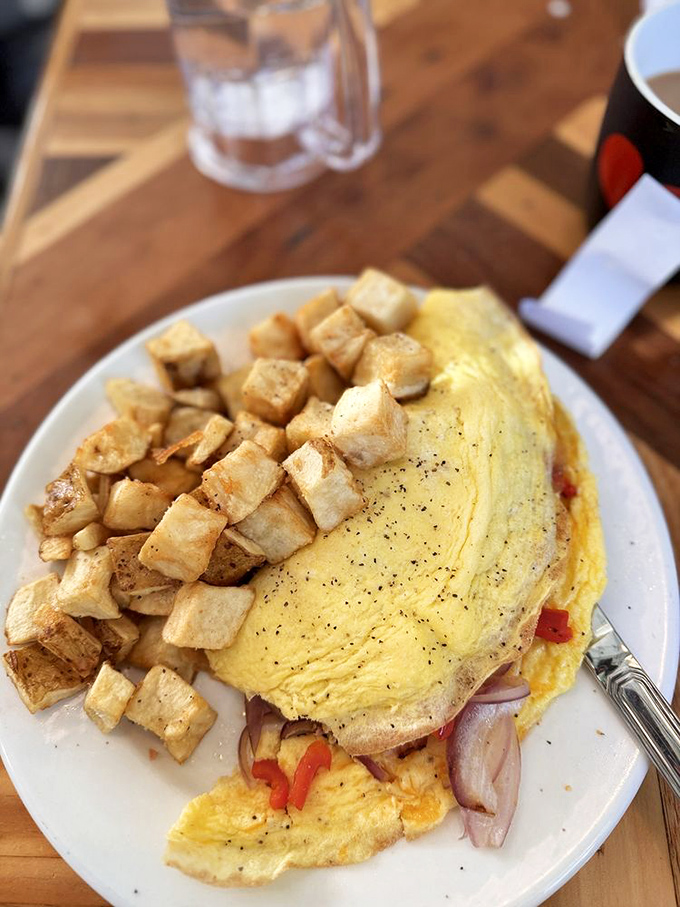 This isn't just an omelet&mdash;it's an architectural marvel of eggs, with home fries that have achieved the perfect crisp-to-tender ratio.