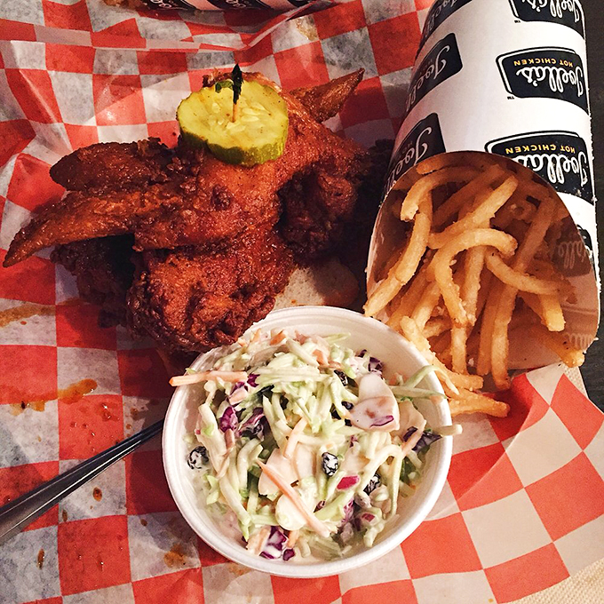 The holy trinity of Southern comfort: spice-kissed chicken, crispy fries, and creamy slaw. This isn't just a meal&mdash;it's a masterclass in textural harmony.
