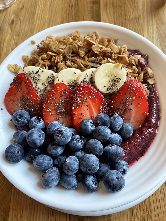 This acai bowl isn't just breakfast&mdash;it's edible art therapy. Blueberries, strawberries, and granola arranged so perfectly you almost feel guilty disrupting it. Almost. 
