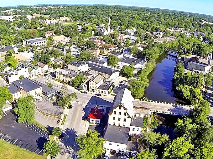 From above, Cedarburg reveals its perfect small-town layout. Cedar Creek winds through the heart of town, the same waterway that once powered the mills that built this community.