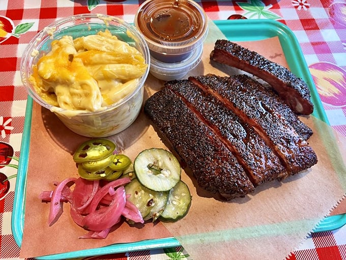 The perfect rib reveals itself in the cross-section&mdash;that pink smoke ring is basically barbecue's equivalent of a Michelin star. 