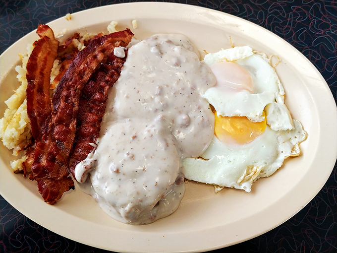 Biscuits and gravy with sunny-side-up eggs and bacon &ndash; the breakfast equivalent of a warm hug from your favorite aunt.