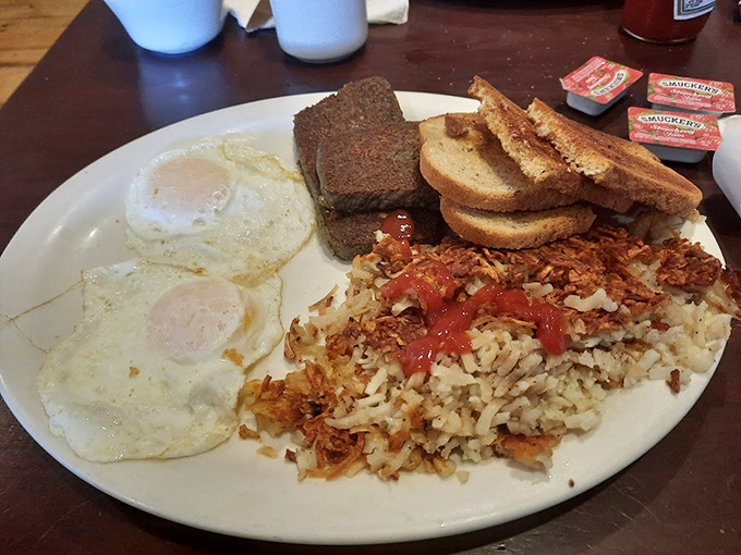 Breakfast served all day because some pleasures shouldn't be confined to morning hours. Eggs, scrapple, and hash browns&mdash;the holy trinity of diner breakfasts.