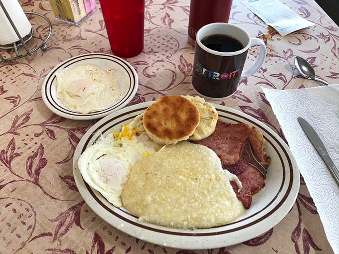 This isn't just breakfast&mdash;it's edible architecture where eggs, ham, and a perfectly toasted biscuit create the morning's most beautiful skyline.