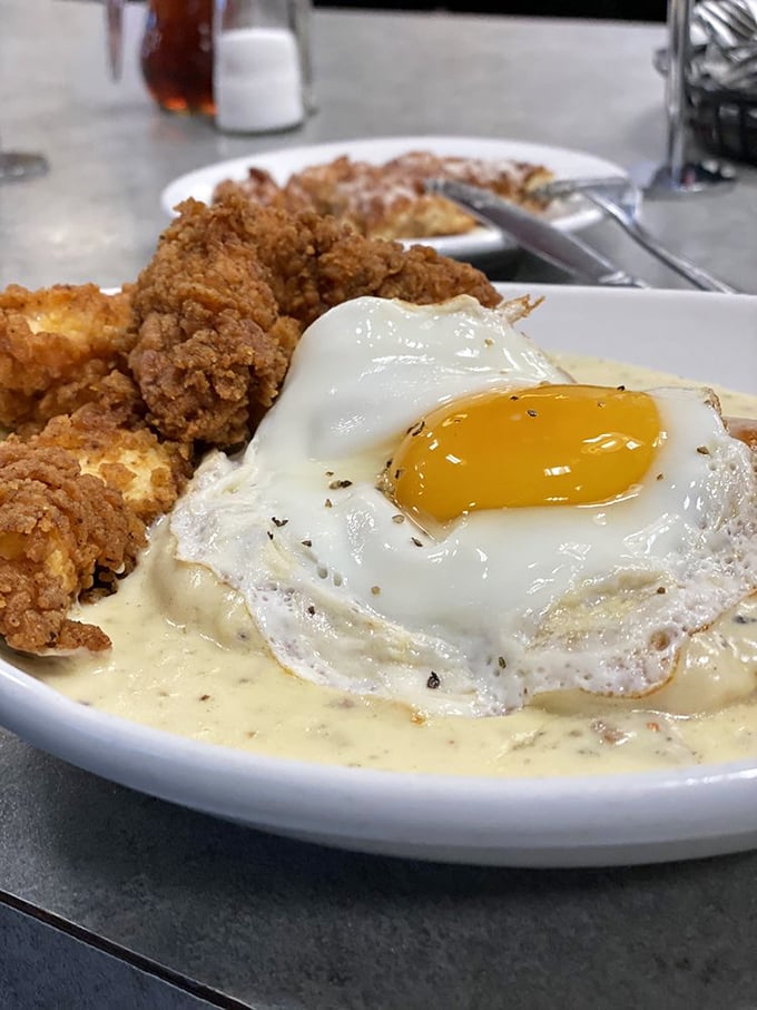 Southern comfort on a plate&mdash;crispy chicken, perfect egg, and creamy gravy. This is what breakfast dreams are made of when angels do the cooking.