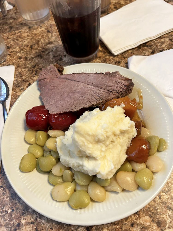 Roast beef that doesn't need a filter, mashed potatoes standing tall like edible Mount Everests, and vegetables that remember what sunshine feels like. This is buffet dining elevated.