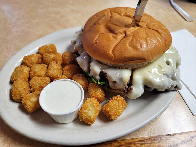 The burger that launched a thousand road trips. Notice how the cheese drapes over the patty like it's getting comfortable for a long, delicious stay. 