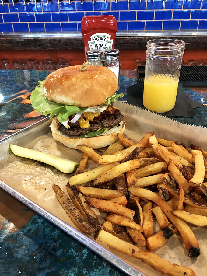 The burger-fries alliance at its finest. This isn't fast food; it's slow food done right, with hand-cut fries that put the drive-thru to shame.