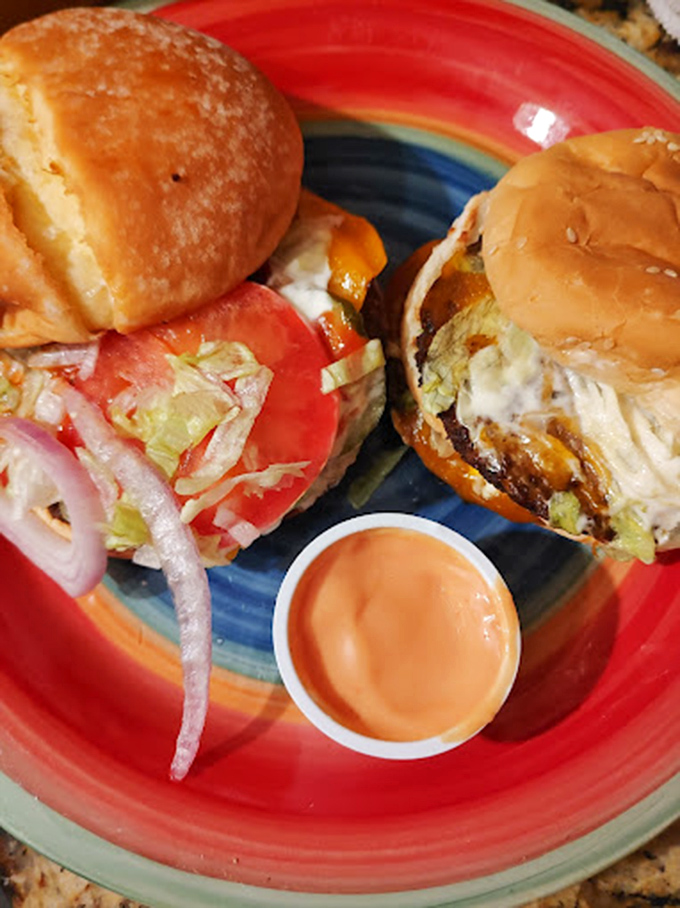 These aren't just burgers; they're architectural marvels of beef, cheese, and fresh toppings that demand a strategic approach to consumption.