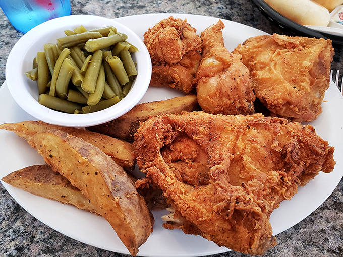 A feast fit for royalty—crispy fried chicken, potato wedges, and green beans that would make your grandmother nod in approval.