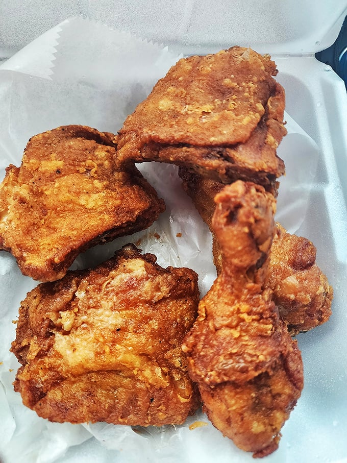 The crust shatters with each bite, revealing juicy meat within &ndash; a textural symphony that makes chain restaurant offerings seem like sad, distant cousins.