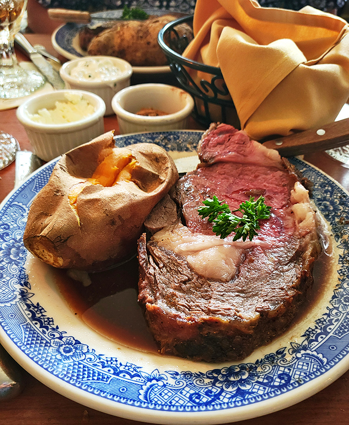 The star of the show: prime rib so perfectly cooked it practically dissolves on contact, accompanied by a Yorkshire pudding that deserves its own declaration of independence.