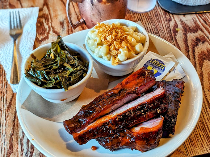 Collard greens and mashed potatoes flanking brisket like loyal sidekicks&mdash;proving vegetables can hang with the meat masterpieces.