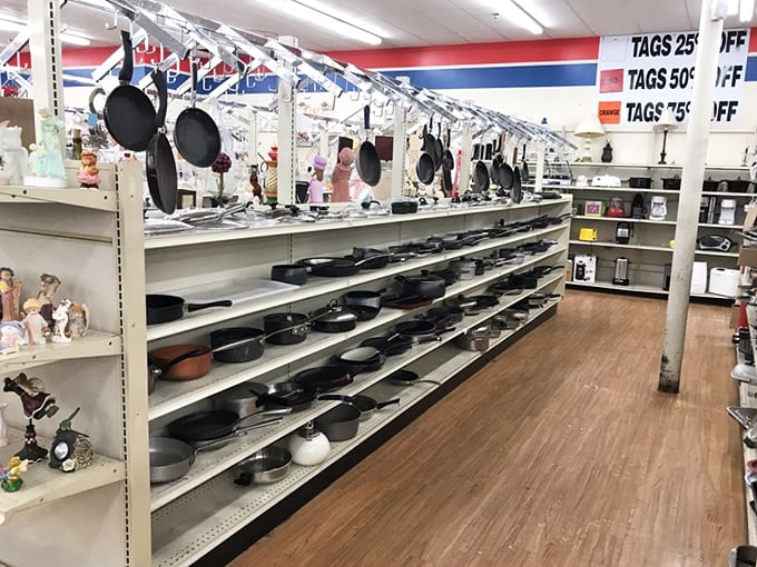 Cast iron skillets with stories to tell hang alongside pots and pans waiting for their second act in your kitchen.