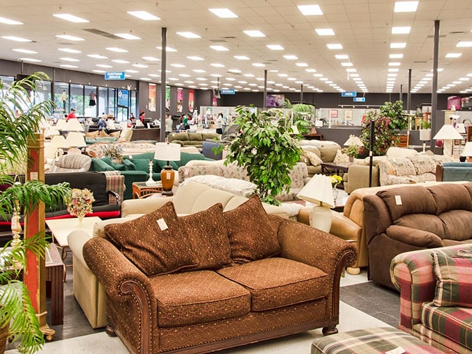 A sea of seating possibilities where you could find your next reading nook companion. That green velvet chair is practically begging for a book club.