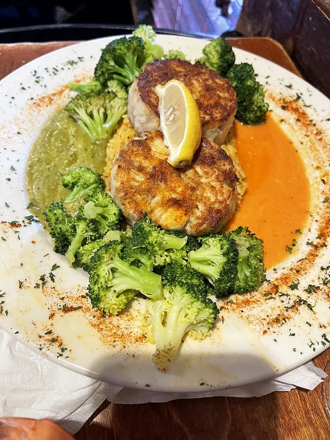 These twin crab cakes surrounded by vibrant broccoli florets are the seafood equivalent of finding front-row concert tickets in your coat pocket.