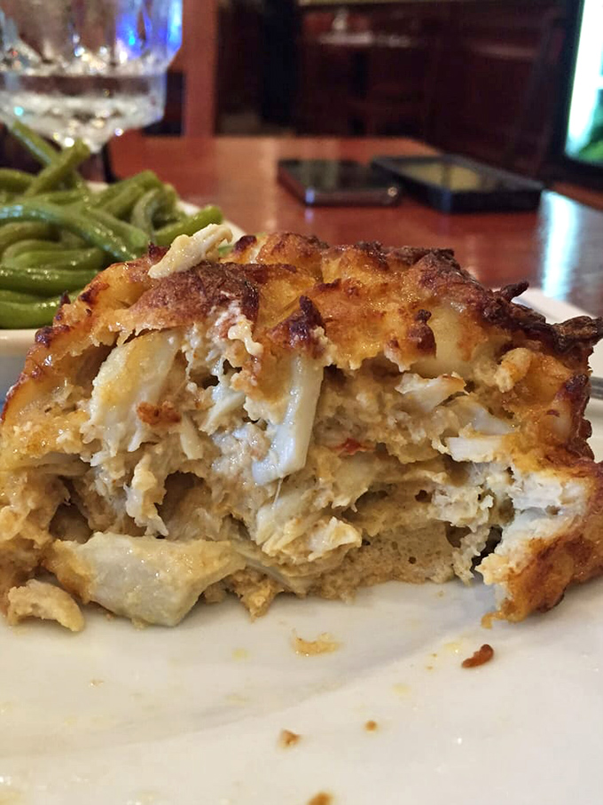 The cross-section reveals the truth: this isn't just a crab cake, it's a crab apartment complex where every resident is deliciously plump and lump.