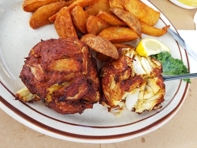 Two perfect specimens of crab cake artistry, bronzed to perfection and practically winking at you with their "just try to resist us" charm.