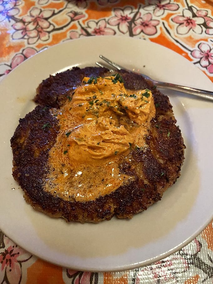 Perfectly crusted on the outside, gloriously tender within. This crab cake with its velvety sauce makes you question everything you thought you knew about Midwestern cuisine.