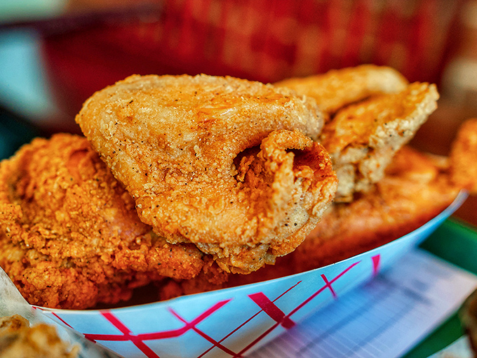 This isn't just fried chicken; it's edible architecture with a perfect ratio of crunchy exterior to juicy interior that would make Frank Lloyd Wright weep.