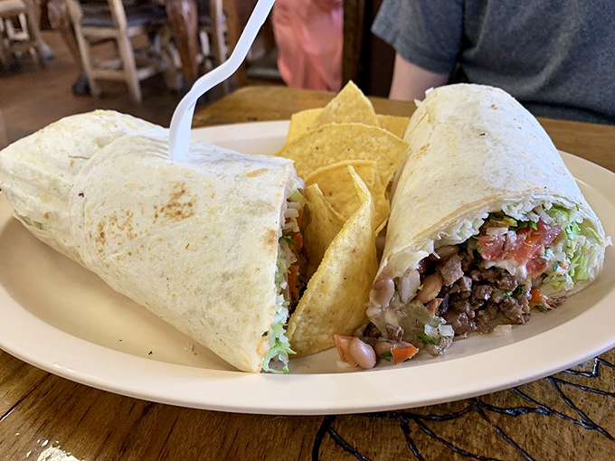 Two burritos, one plate, infinite happiness. That lime wedge isn't just garnish—it's the conductor of this symphony of flavors.