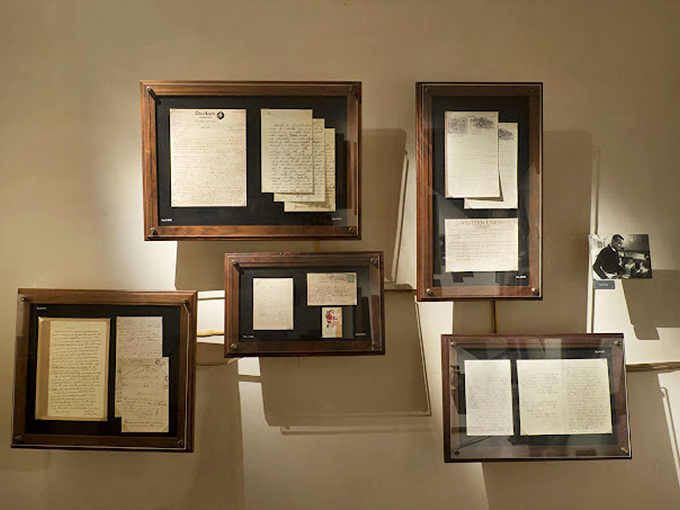 Letters to astronomers, displayed with reverent care. Each frame contains someone's earnest attempt to make sense of the incomprehensible.