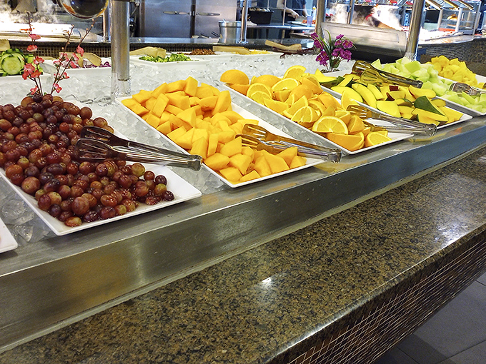 The fresh fruit station: where you pretend to be health-conscious after your third plate of crab legs. That pineapple isn't just garnish&mdash;it's strategic stomach real estate.