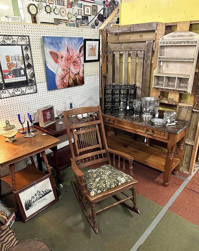 That rocking chair isn't just furniture; it's a time machine with armrests. The whimsical pig painting adds just the right touch of farmhouse charm.