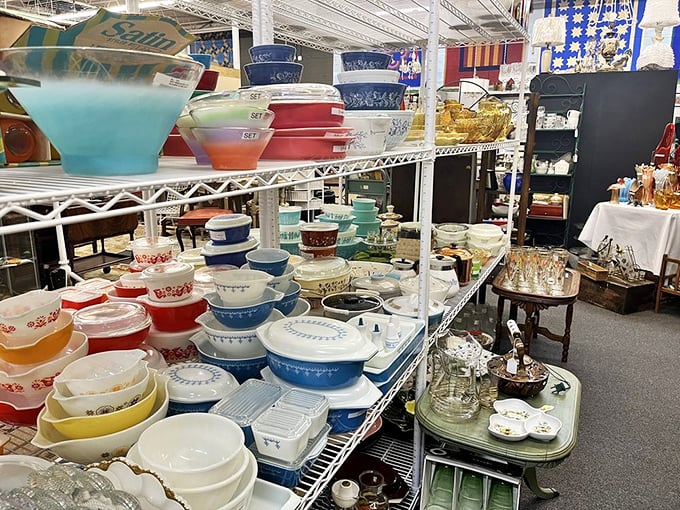 A rainbow of vintage Pyrex bowls that would make Marie Kondo reconsider her minimalist philosophy. Each pattern tells a story of American kitchen evolution.
