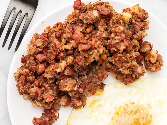 This isn't your sad canned hash&mdash;it's a glorious tangle of crispy-edged corned beef and potatoes that would make your grandmother weep with joy.