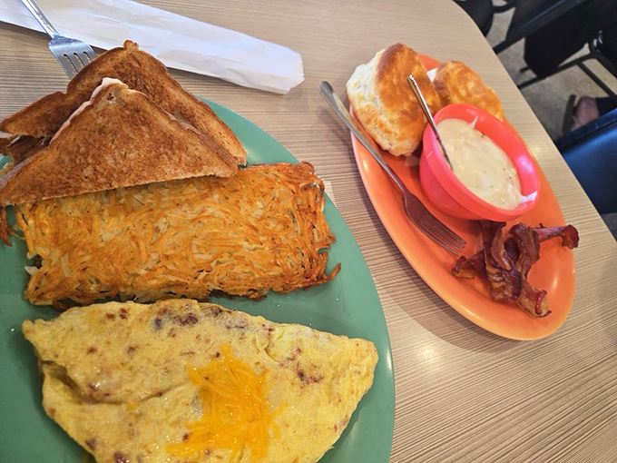 Crispy edges, tender inside &ndash; this is hash brown engineering at its finest, sharing a plate with an omelette that deserves its own fan club.