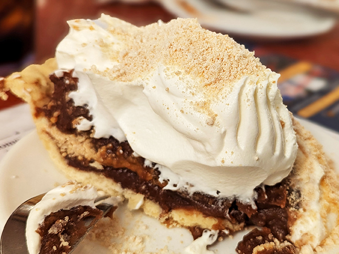 Layers of decadence in every bite of this cream pie. The whipped topping isn't just a garnish&mdash;it's a cloud of dairy perfection crowning a masterpiece of flavor.