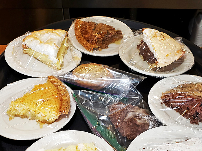 The dessert case at Blake's—where life-changing decisions happen daily. Chocolate, coconut cream, or just say "yes" to all of them?