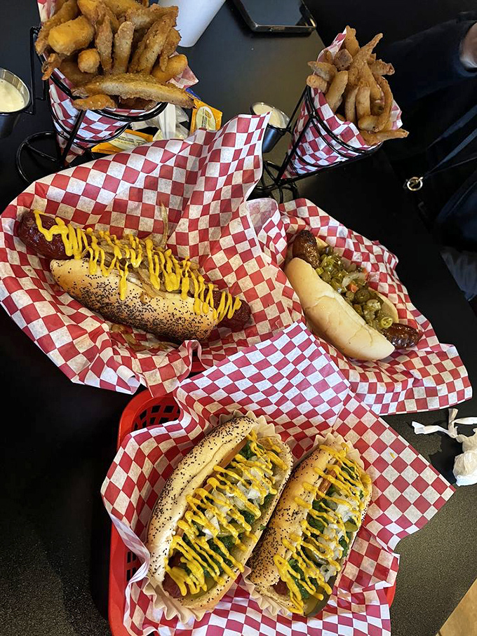 Hot dog heaven on red-and-white checkered paper. This spread isn't just lunch&mdash;it's a Chicago-style feast worth driving across state lines for.