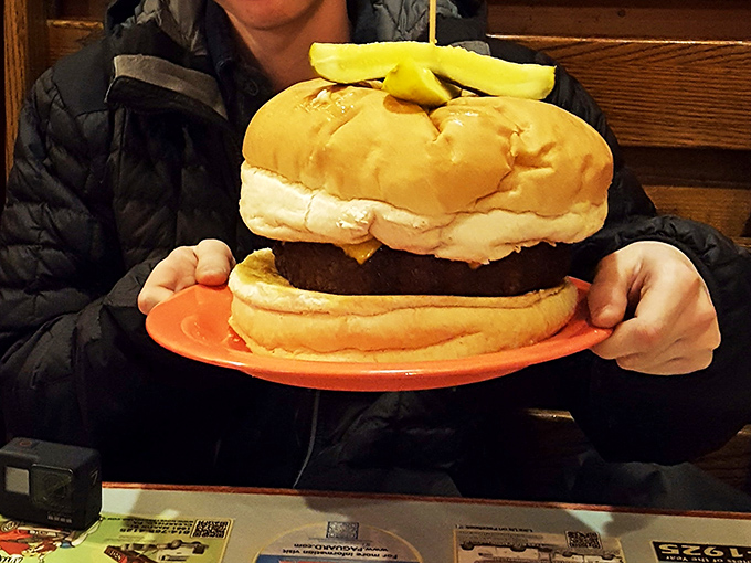 I'd like a burger the size of my head, someone said, and Denny's responded, "Why stop there?" Pickle garnish included for "health."