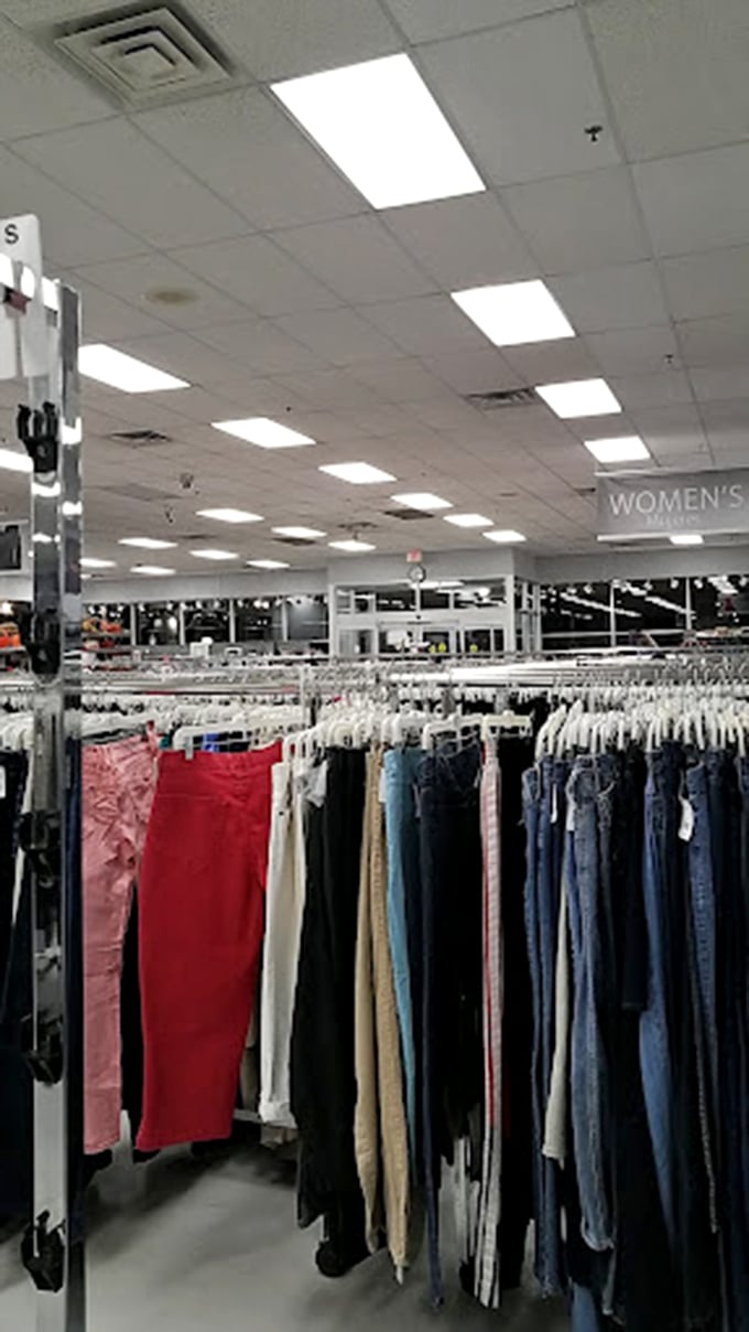 Bright lights, big savings! The women's section stretches into infinity, a denim sea where your next favorite pair of pants is waiting to be discovered.