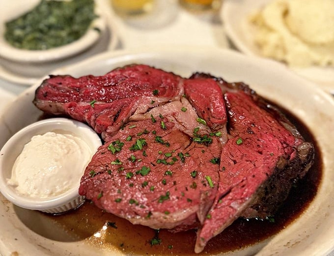The King's Cut prime rib arrives like royalty&mdash;perfectly pink, impressively thick, and crowned with just enough fresh herbs to know someone cares.