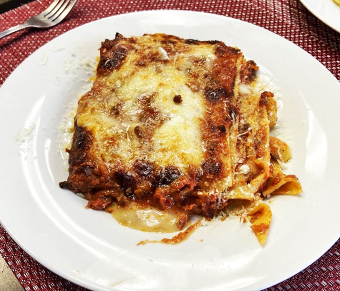Lasagna so perfectly layered it could teach architecture students a thing or two. That golden cheese crust deserves its own fan club.